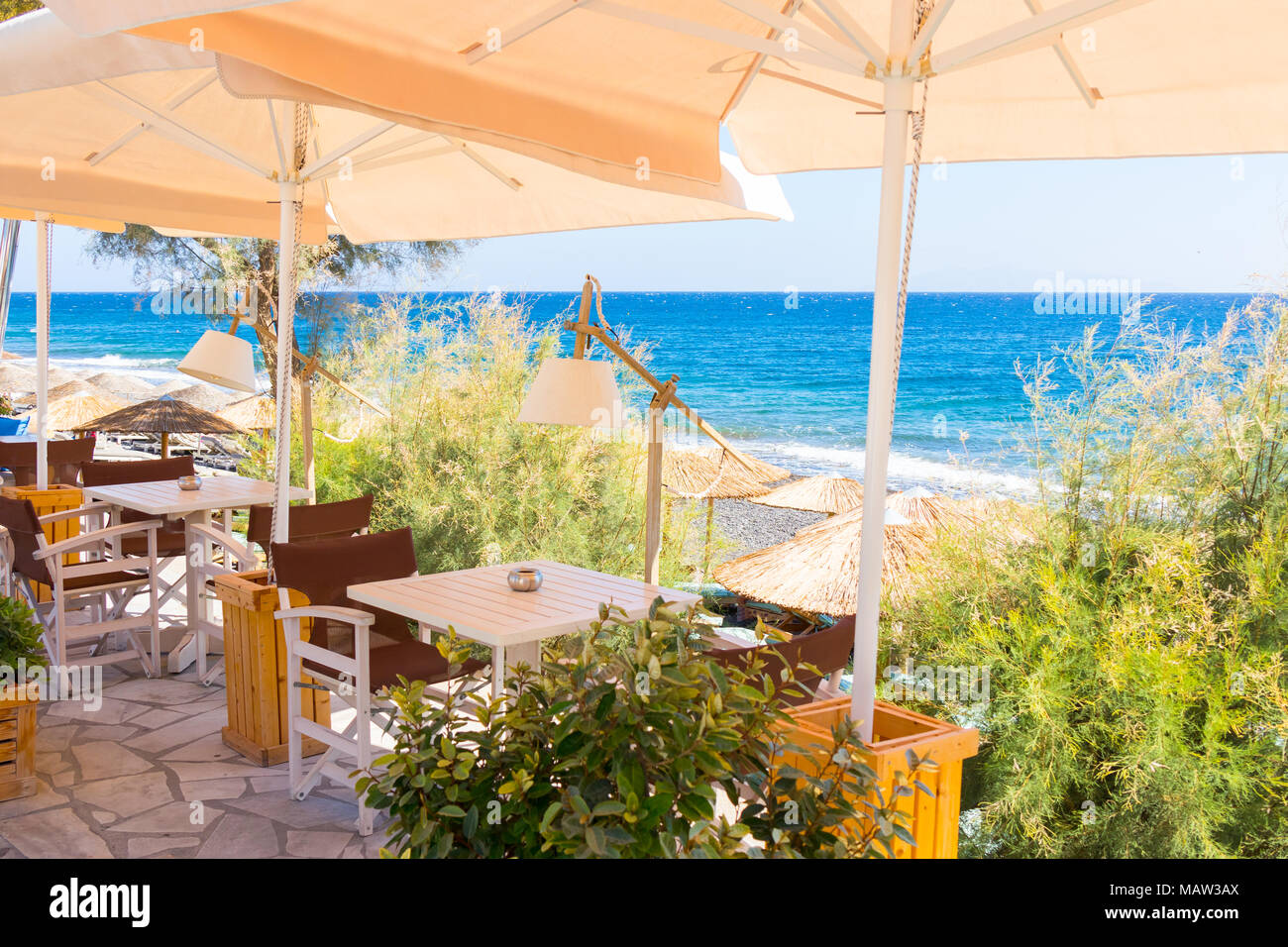 restaurant terrace in front of the beach in kamari on the island of ...