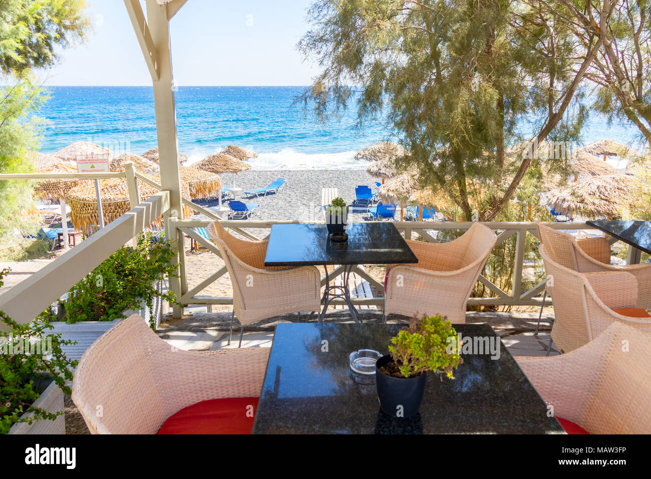 restaurant terrace in front of the beach in kamari on the island of ...