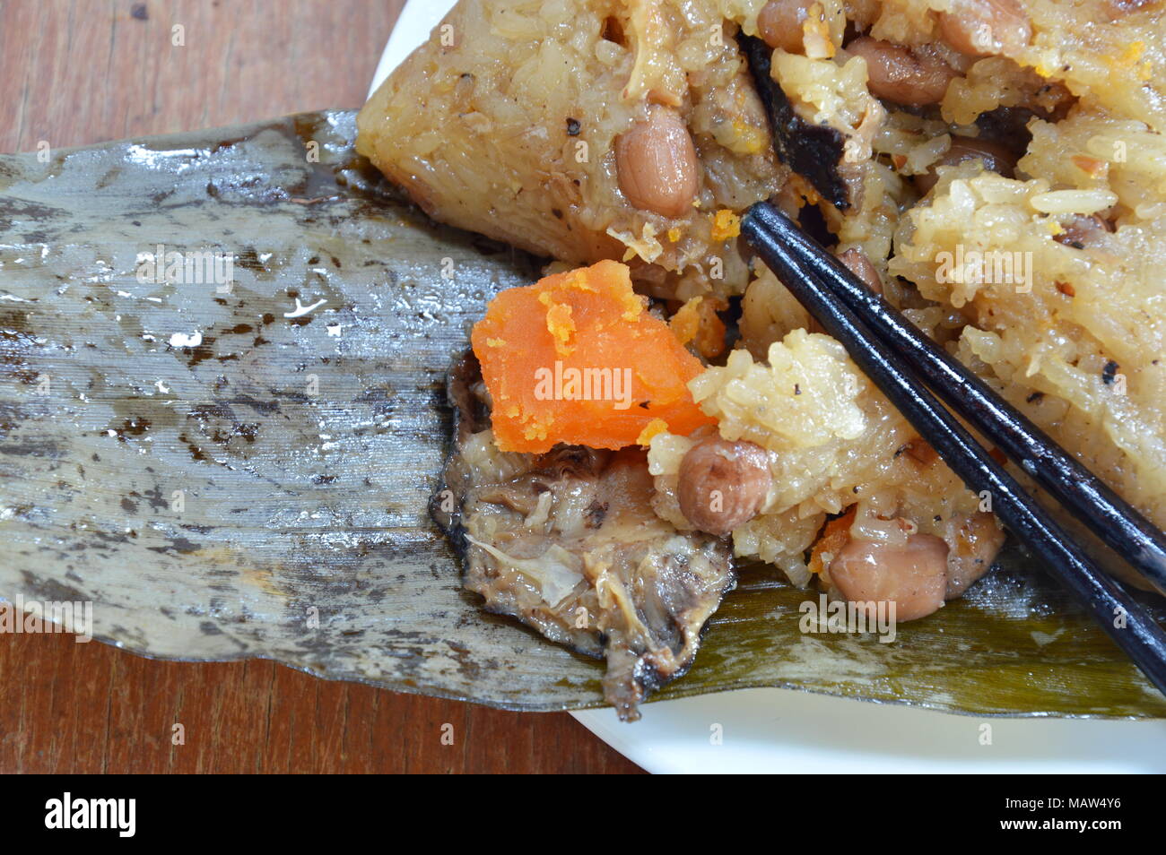 sticky rice steam with pork and salt egg in banana leaf of Chinese ...