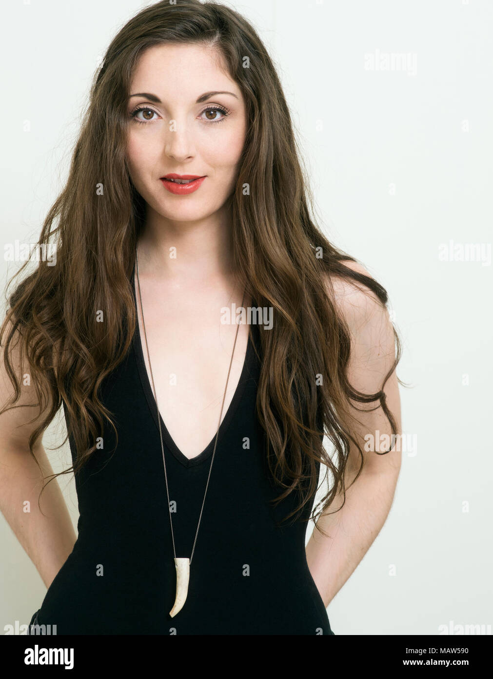 Confident woman dark hair hi-res stock photography and images - Alamy