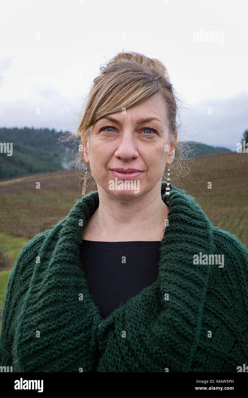 Sad woman looking at camera outside hi-res stock photography and images ...