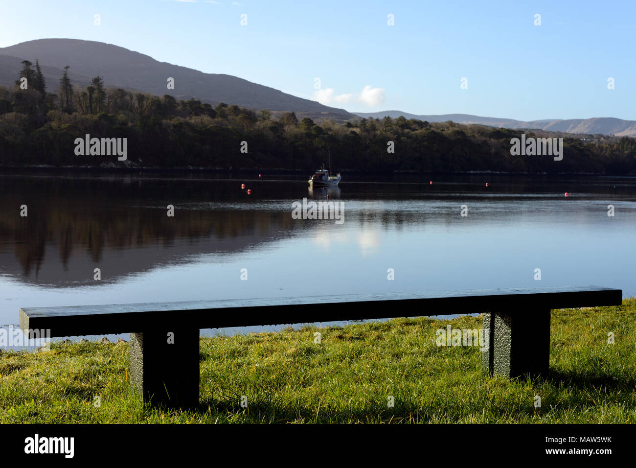 Lone bench at Kenmare River bay in Kenmare, County Kerry, Ireland Stock ...