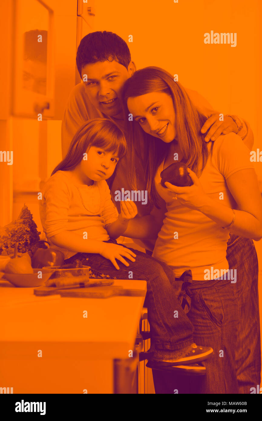 happy young family have lunch time with fresh fruits and vegetable food ...