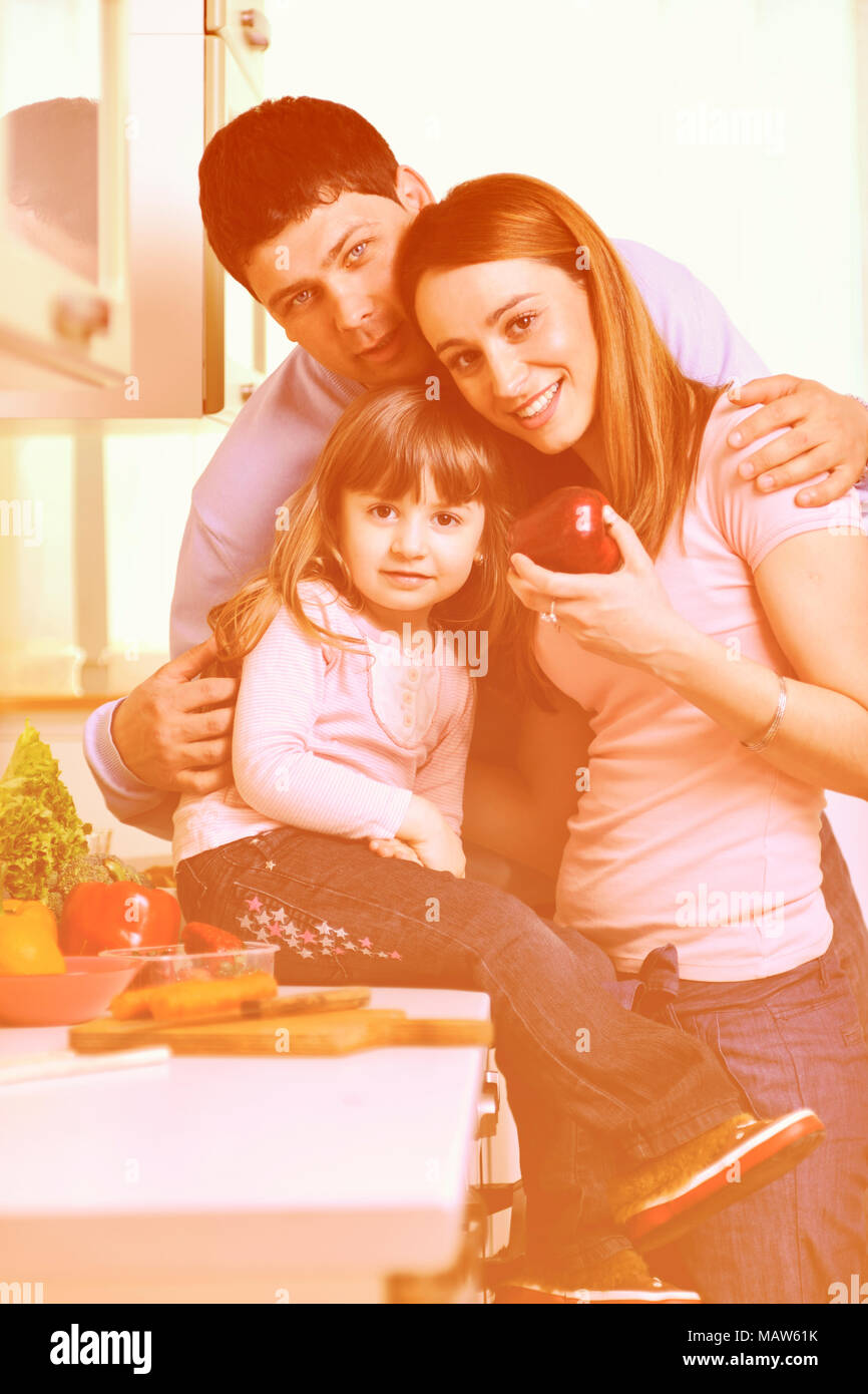 happy young family have lunch time with fresh fruits and vegetable food ...