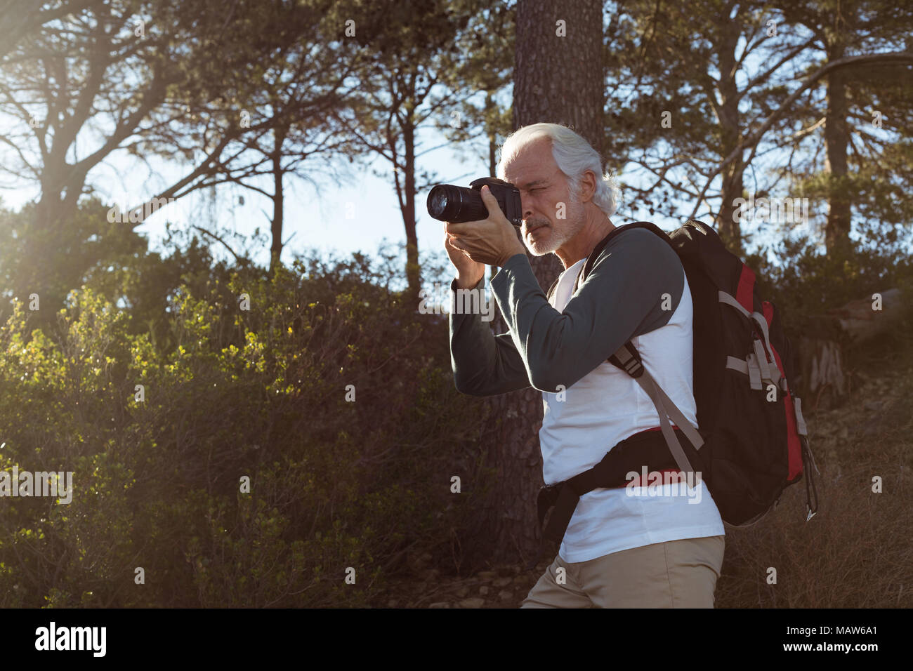 Senior hiker taking photo with digital camera Stock Photo - Alamy