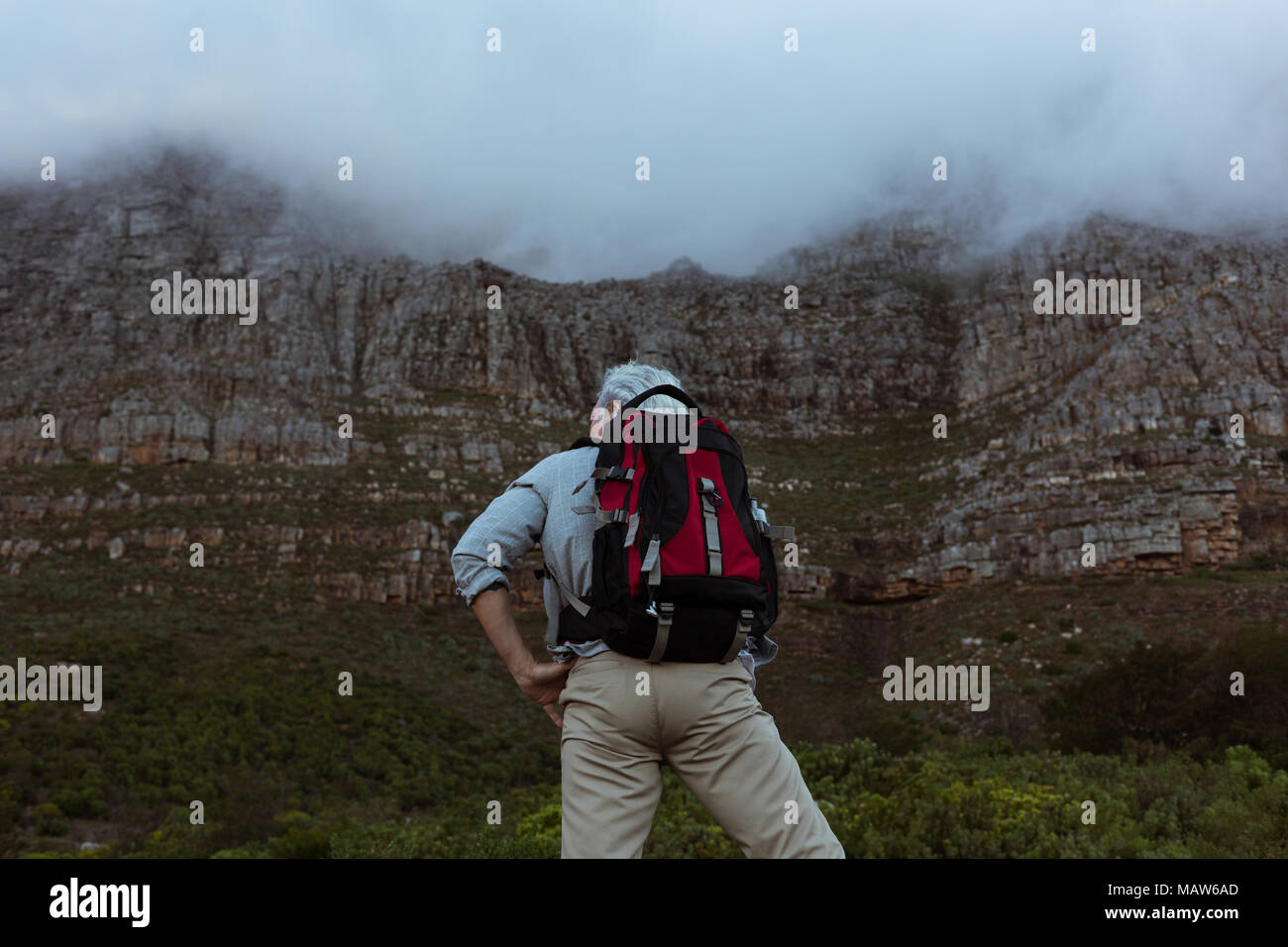 Hiker looking town in hi-res stock photography and images - Alamy