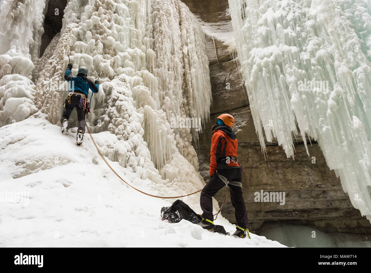 Mature woman climbing mountain hi-res stock photography and images - Alamy