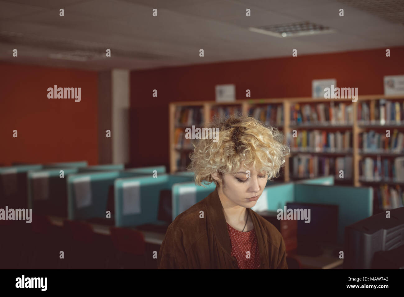 Woman library thinking hi-res stock photography and images - Alamy