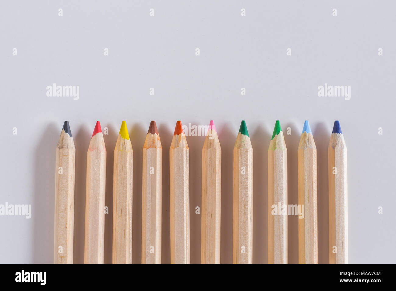 Color pencils are used. On the ground is a white paper prepared for ...