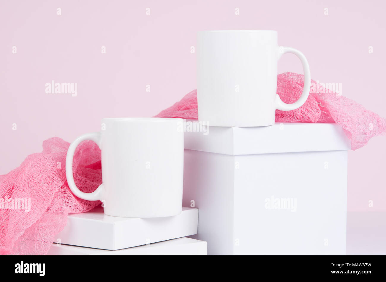 two blank white coffee mug mock ups Stock Photo - Alamy