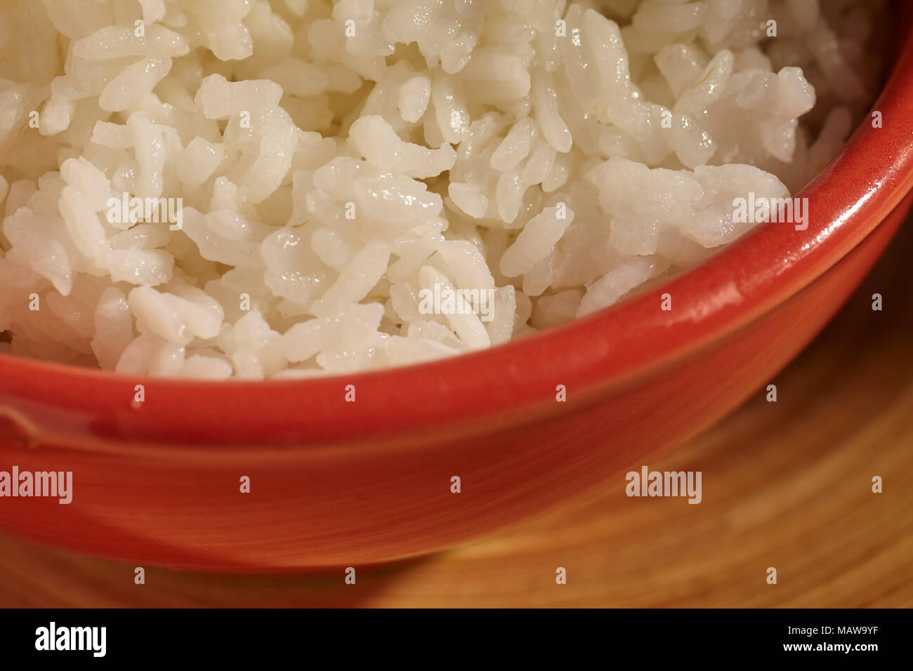 A bowl of cooked short grain white rice, commonly used in Korean and ...