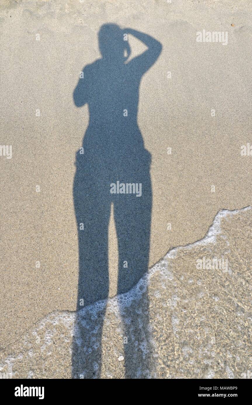 Body covered sand hi-res stock photography and images - Alamy