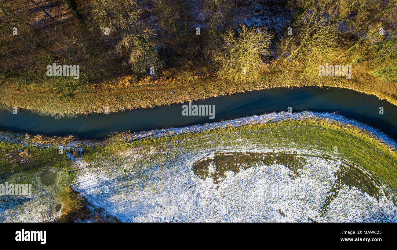 Aerial view of a river from above at the end of the winter Stock Photo ...