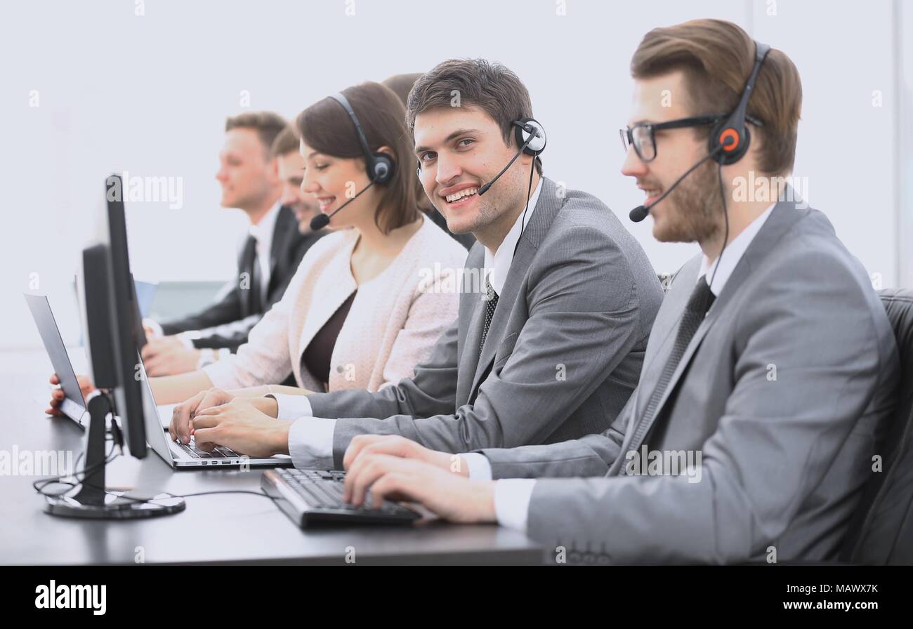 employee call center with headset at workplace Stock Photo - Alamy