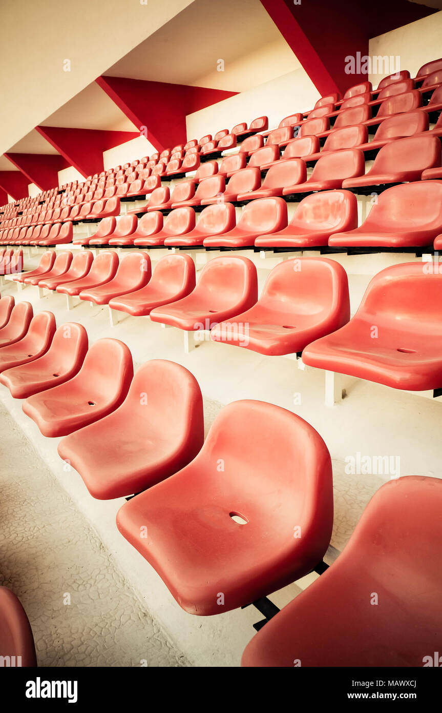 row of red seat at public sport stadium Stock Photo - Alamy