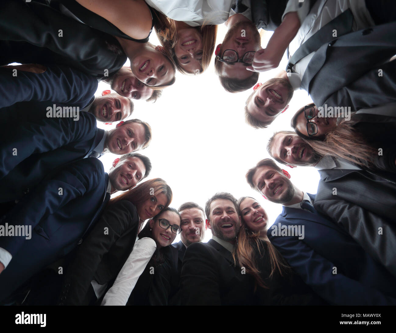 large business team is forming a circle and looking at the camera Stock ...