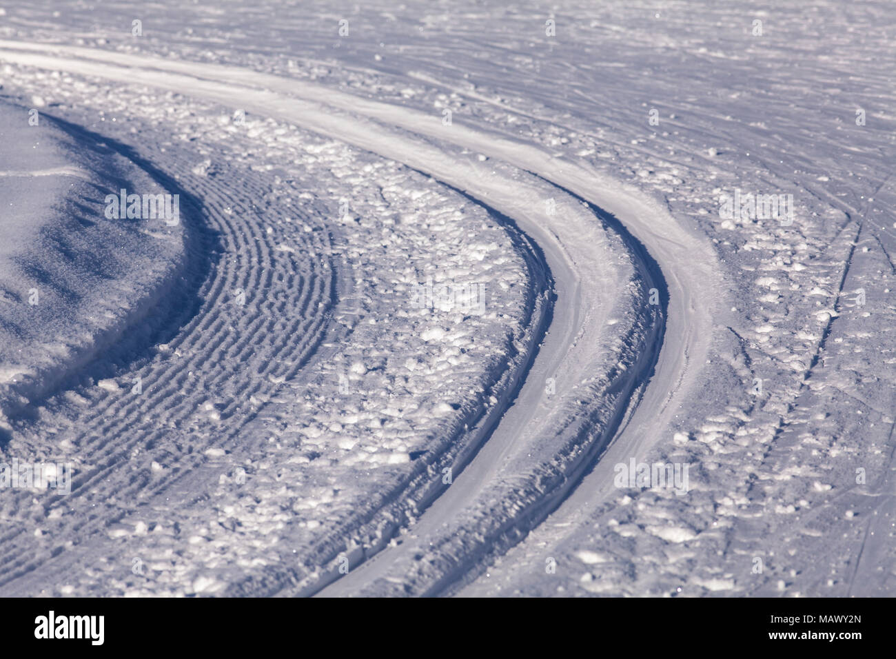 Closeup on Cross-country skiing tracks in winter landscape. Shadows and ...