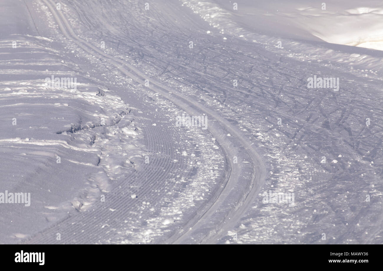 Closeup on Cross-country skiing tracks in winter landscape. Shadows and ...