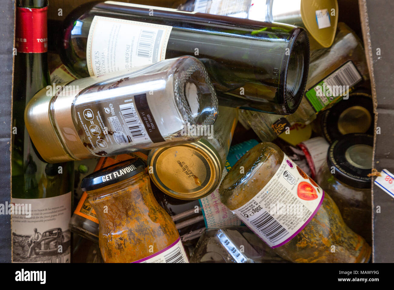 Cardboard box with glass bottles and jars for recycling Stock Photo - Alamy