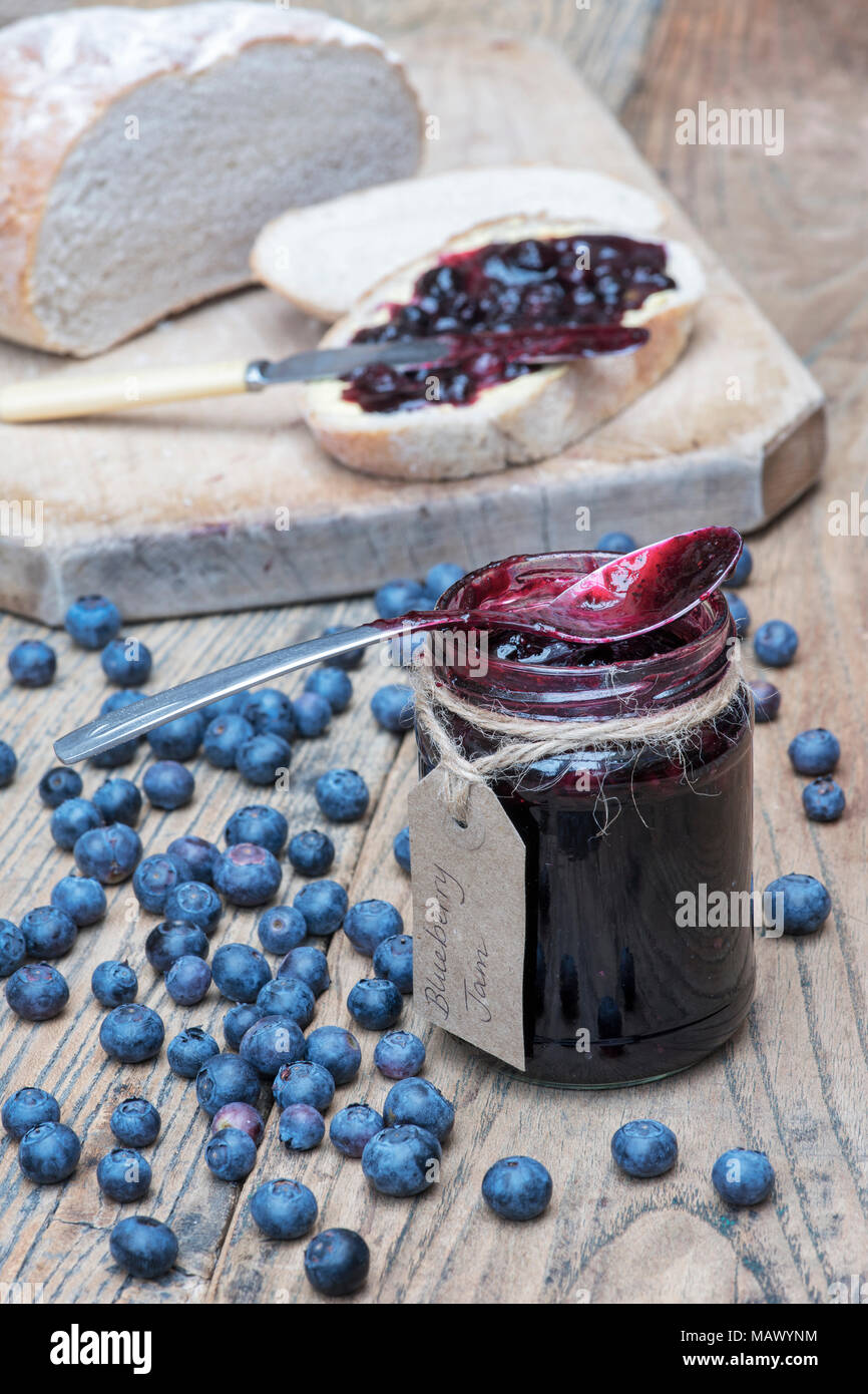 Homemade Blueberry jam and bread on a wood background Stock Photo - Alamy