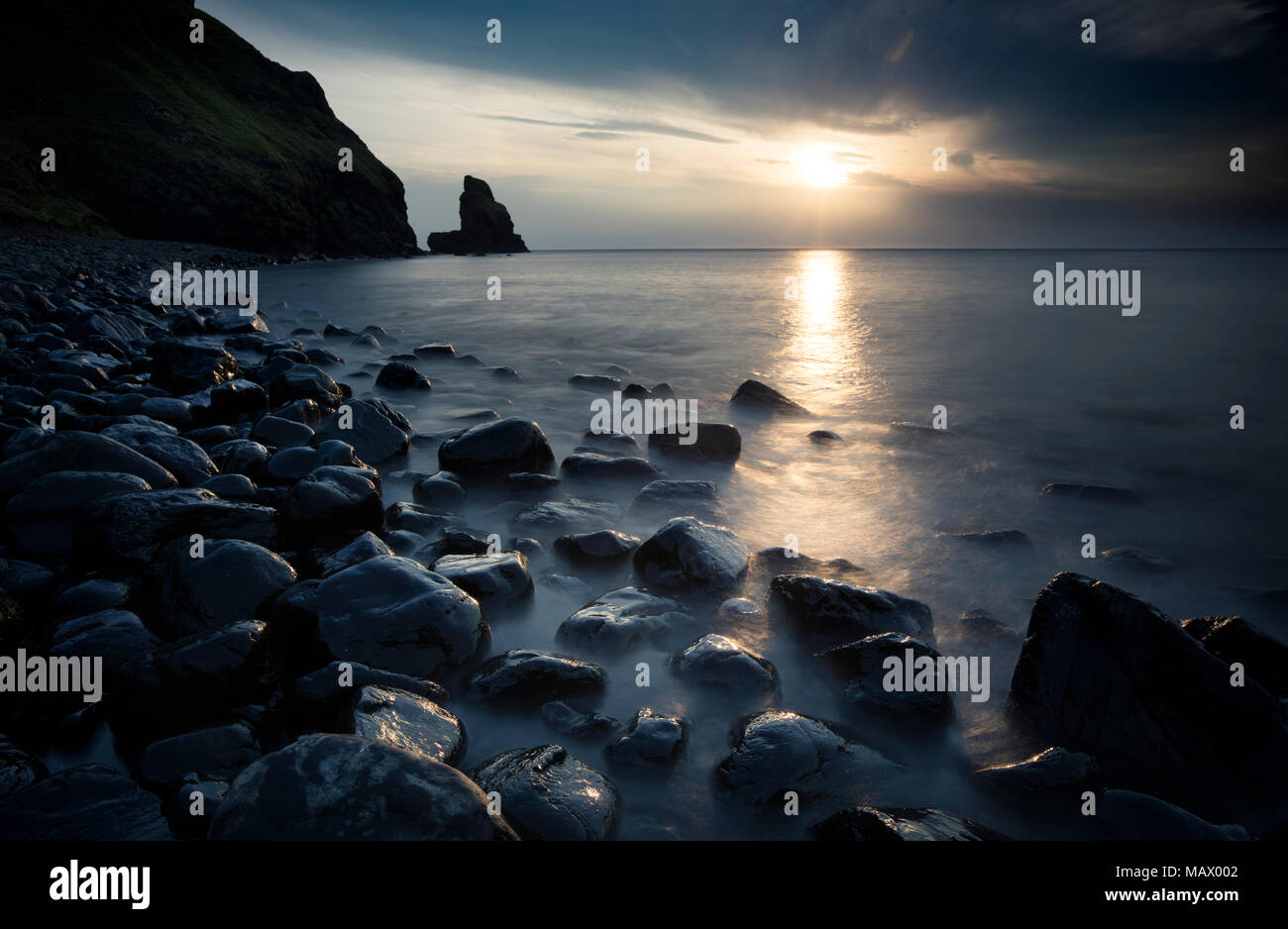 Sea stack at sunset on Talisker Bay, Isle Of Skye Stock Photo - Alamy