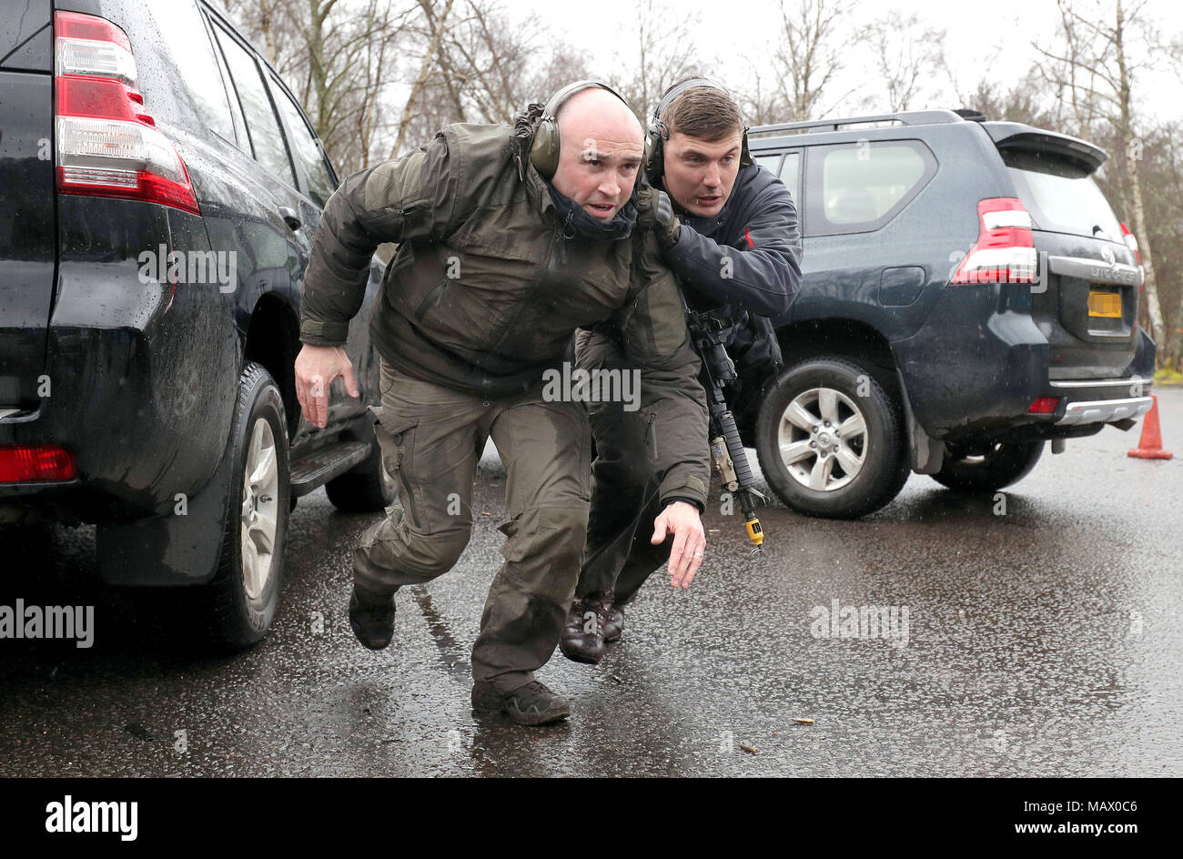 A member of the Close Protection Unit Royal Military Police (right ...