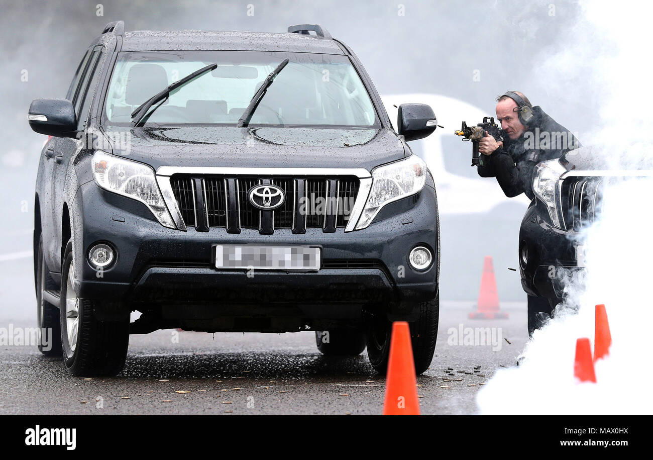 A member of the Close Protection Unit Royal Military Police carries out ...