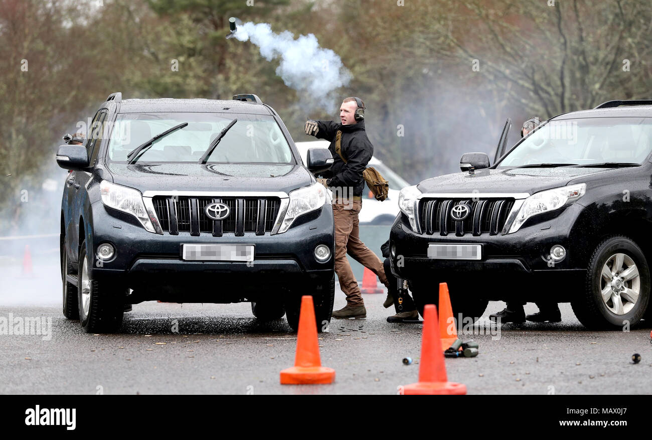 A member of the Close Protection Unit Royal Military Police carries out ...