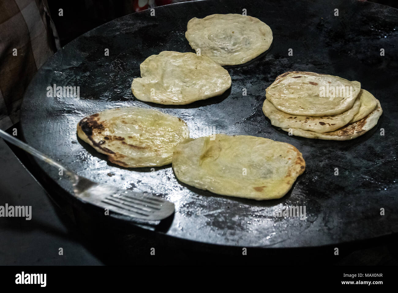Making of Roti Canai, Roti cooking process, roti fried indian food ...