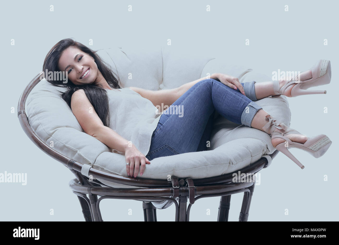 modern young woman relaxing in a round cozy soft chair Stock Photo - Alamy
