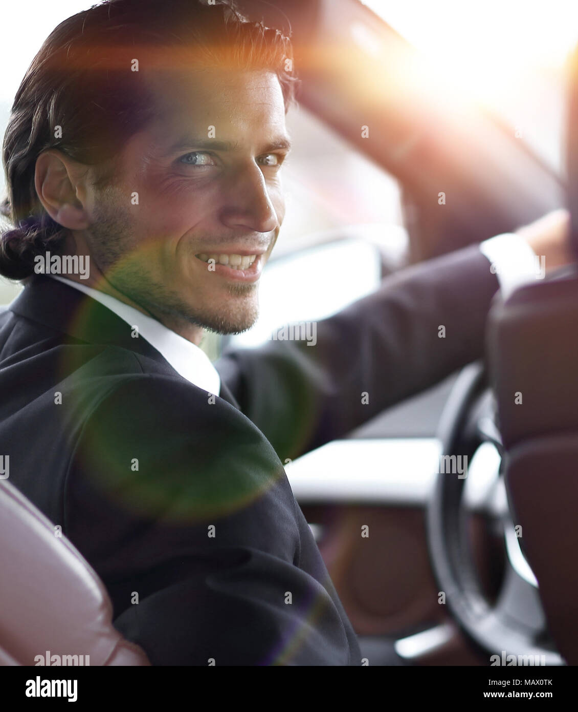 man sitting behind the wheel of a car Stock Photo - Alamy