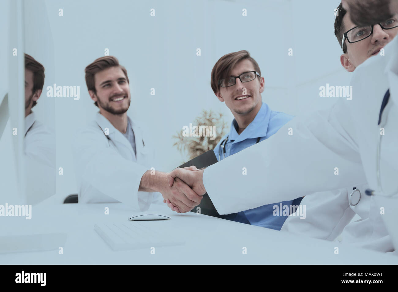 Handshake medical colleagues meeting hi-res stock photography and ...