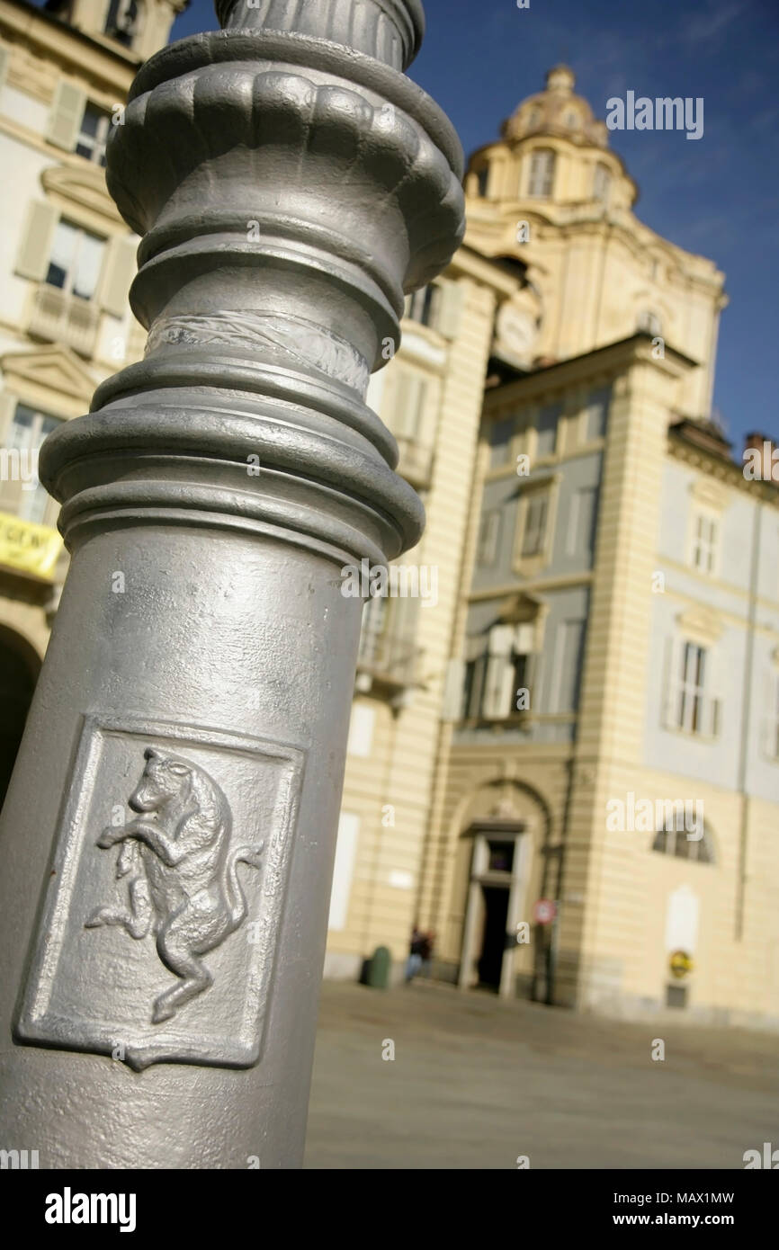 Ornate cast metal streetlight base in the form of a bull, the symbol of ...