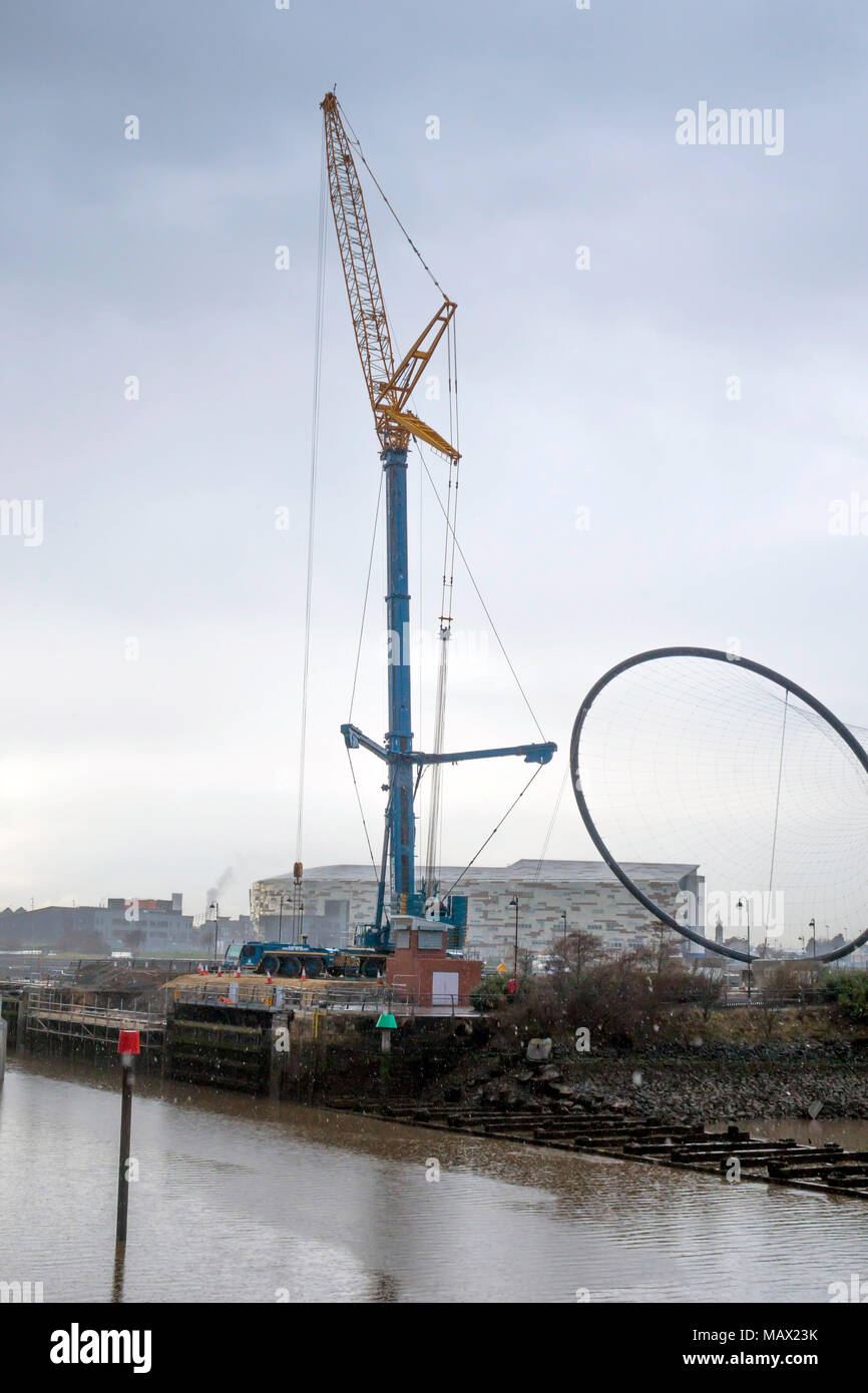 A large Mobile Crane working on the construction of a new road bridge ...