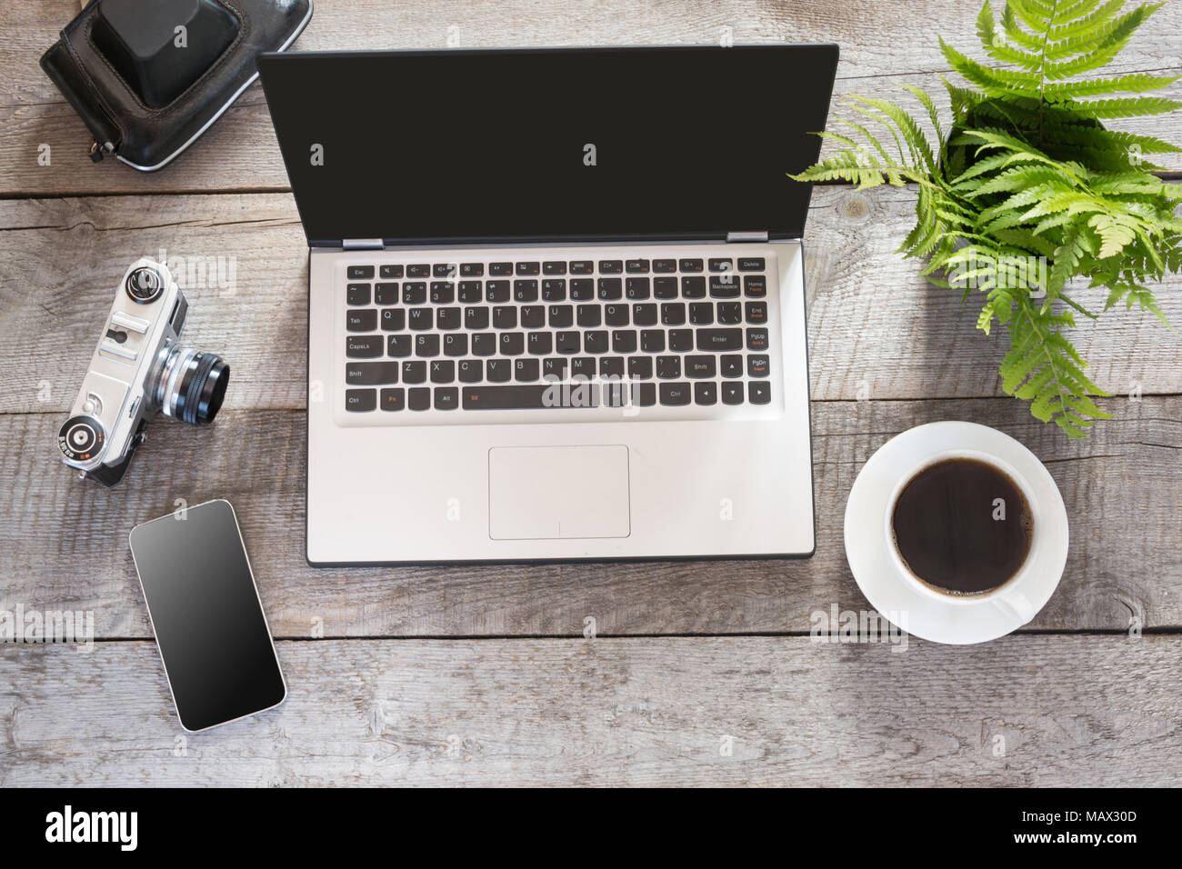 Open laptop with set for reporter on office wooden desk table. Top view ...