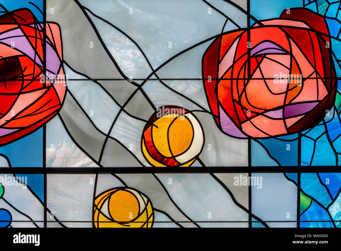 Detail of a modern colorful stained glass window in a church or chapel ...