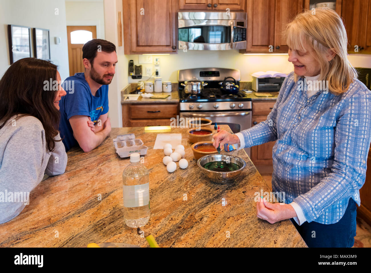 Family Dyeing Easter Eggs In Kitchen Stock Photo Alamy family-dyeing-easter-eggs-in-kitchen-stock-photo-alamy