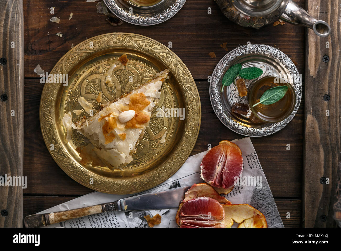 Traditional moroccan copper plate with piece of pie Stock Photo - Alamy