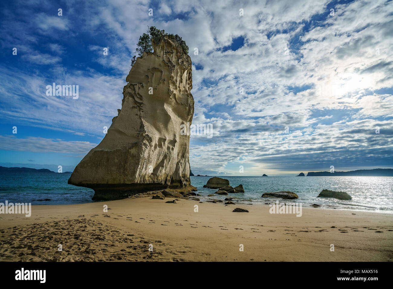 sand and the mighty sandstone rock monolith in the water of cathedral ...