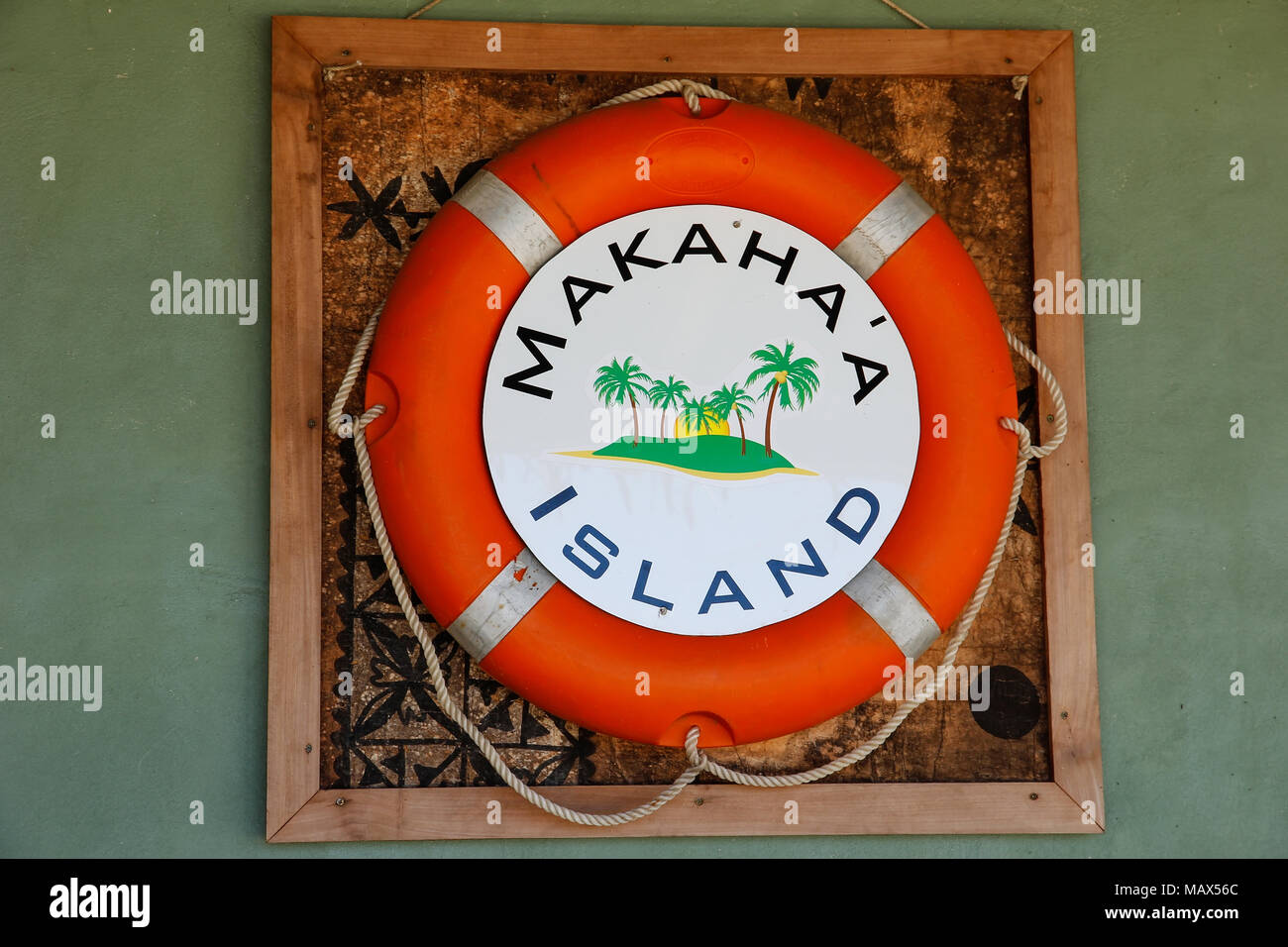 Life bouy on the wall at Makaha'a island near Tongatapu island in Tonga ...
