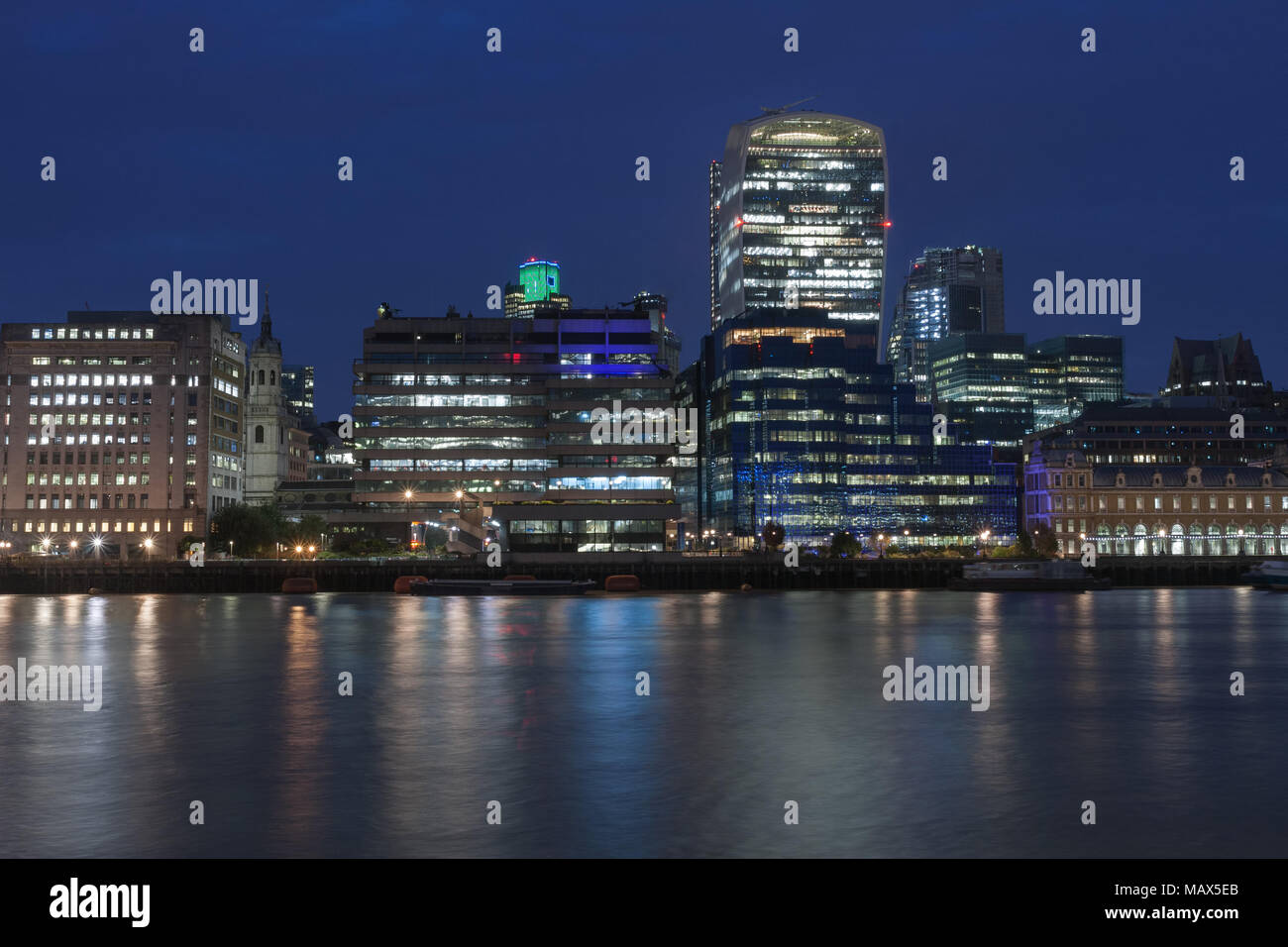 Thames embankment and london skyscrapers in City of London in the night ...