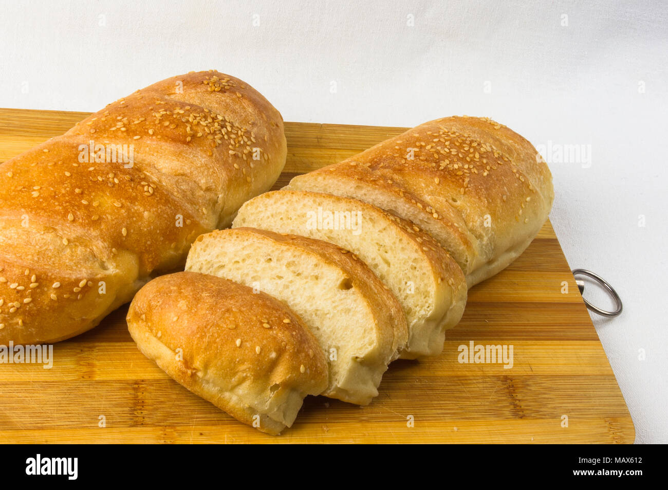 sliced whole wheat breads on a chopping Board Stock Photo - Alamy