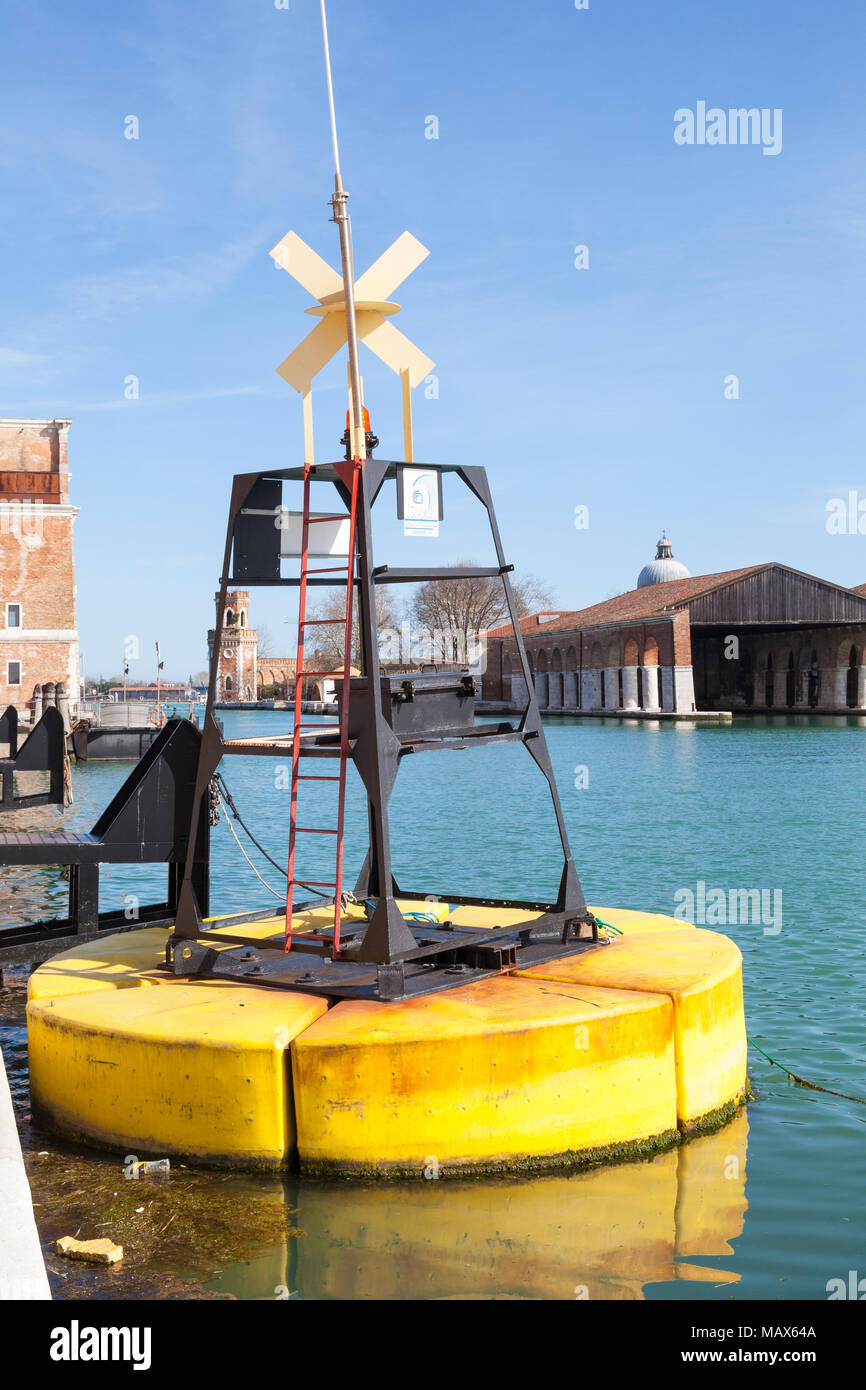 Yellow navigation buoy floating in the in Darsena Nuovissima at the ...