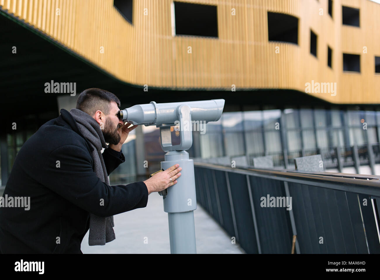 Tourist man observing Stock Photo - Alamy
