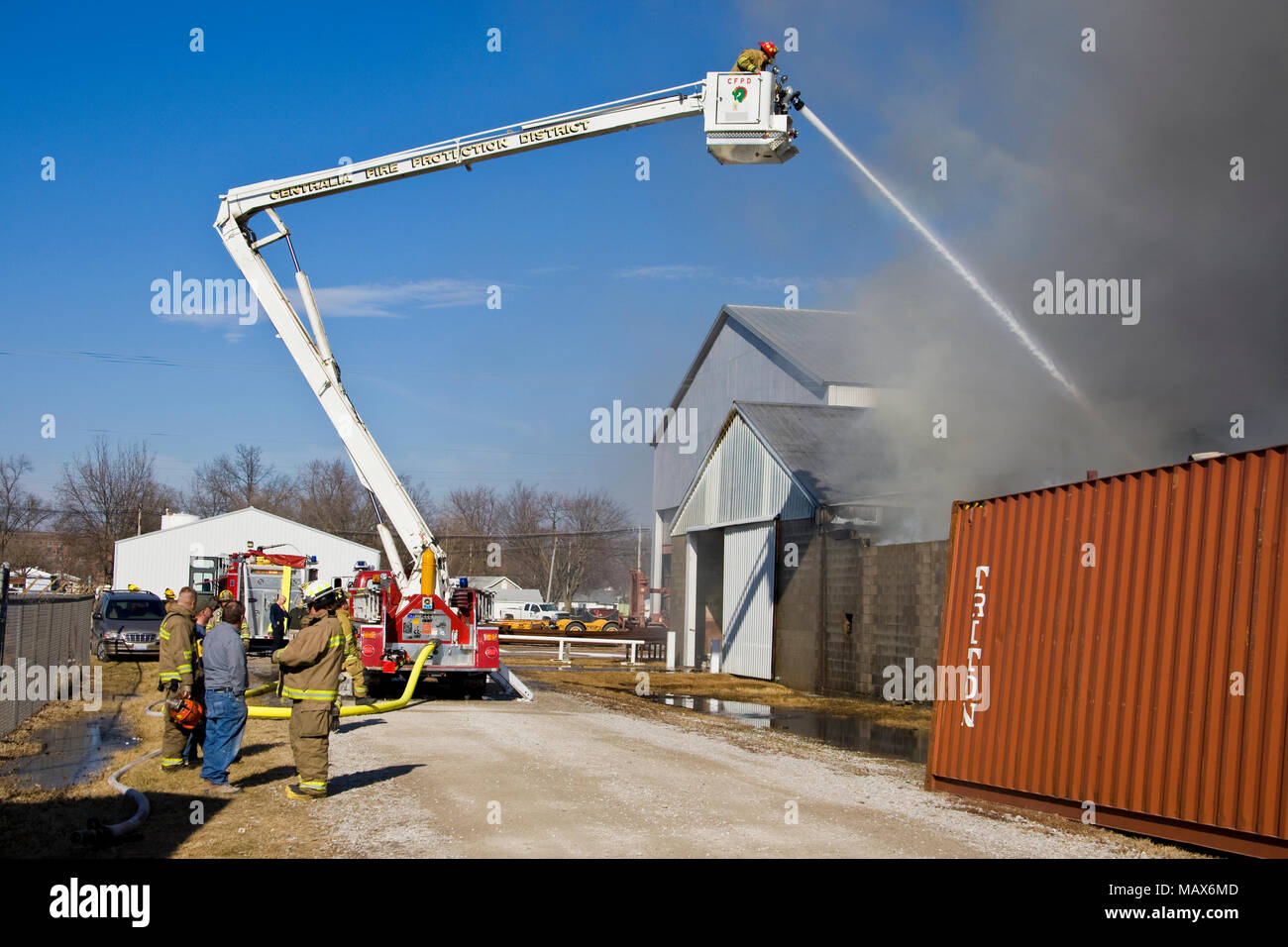 63818-02302 Firefighters extinguishing warehouse fire using aerial ...