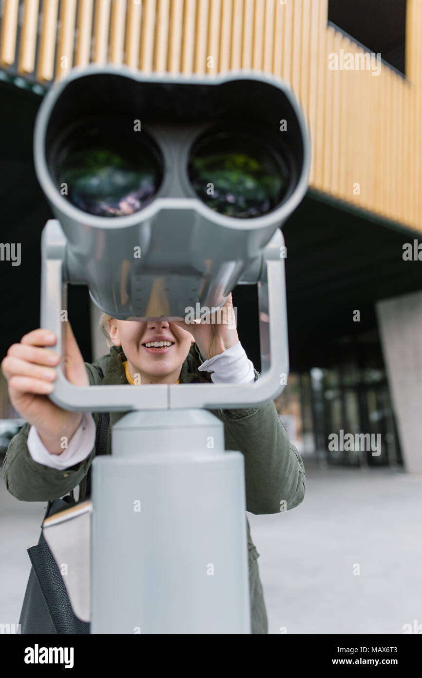 Girl Looking Through a Binoculars. Tower Viewer Stock Photo - Alamy