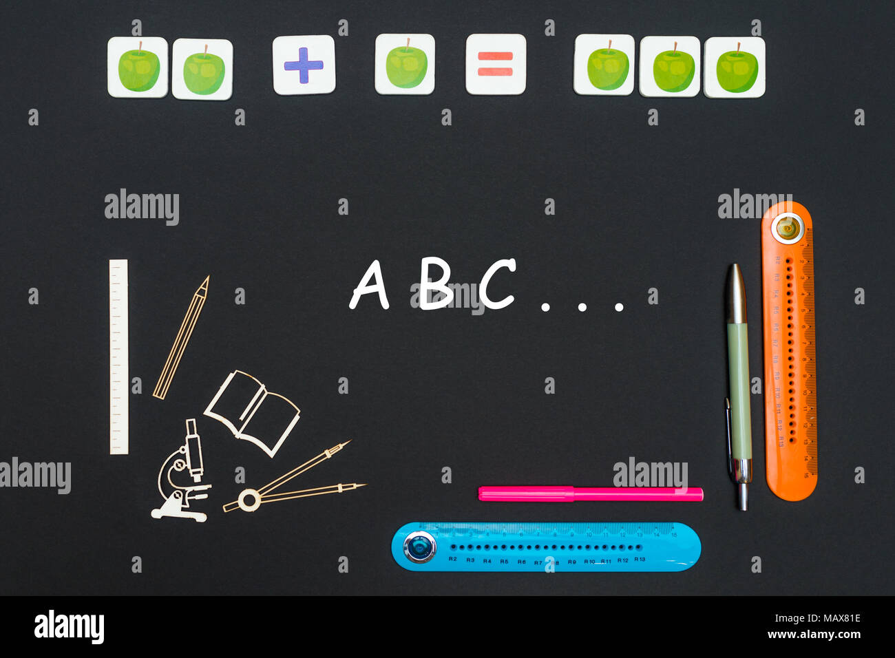 concept back to school, above stationery supplies and text abc on black ...