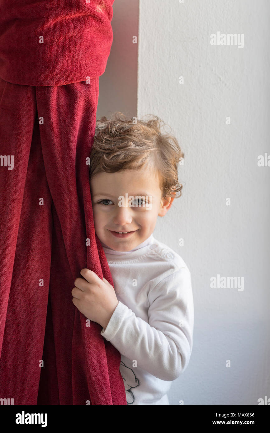 Hiding behind a curtain kid hi-res stock photography and images - Alamy