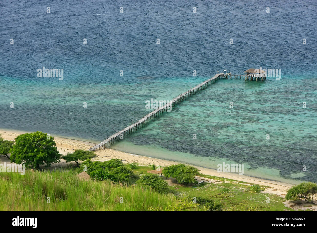 Long wooden jetty at Kanawa Island in Flores Sea, Nusa Tenggara ...