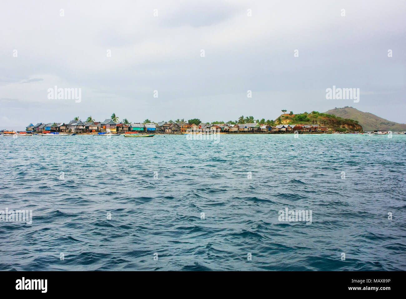 Small island with typical village in Komodo National Park, Nusa ...